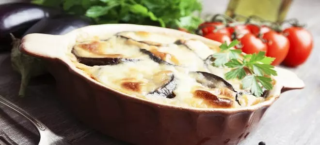 Eggplants with vegetables baked under sour cream sauce