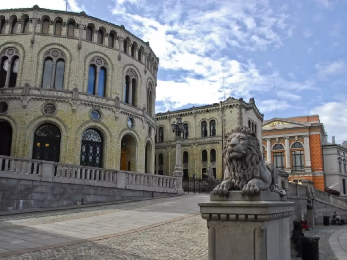 Entrance to the building is guarded by majestic stone lions