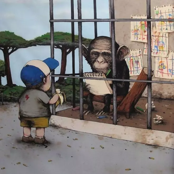 Niño y mono en el zoológico