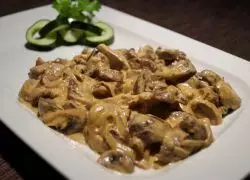 Meat with mushrooms in sour cream sauce