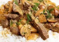 Meat with mushrooms in sour cream in a slow cooker