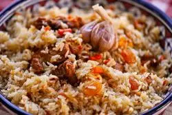 Beef pilaf in frying pan