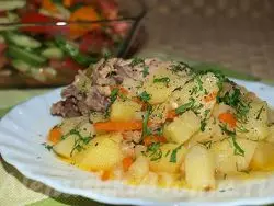 Delicious stewed potatoes in a slow cooker